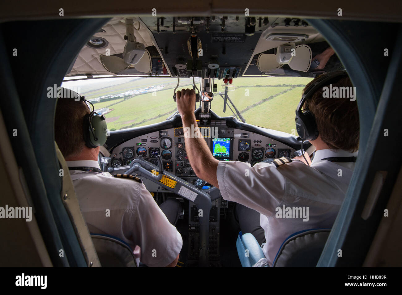 Aircraft Cockpit with pilots Stock Photo - Alamy