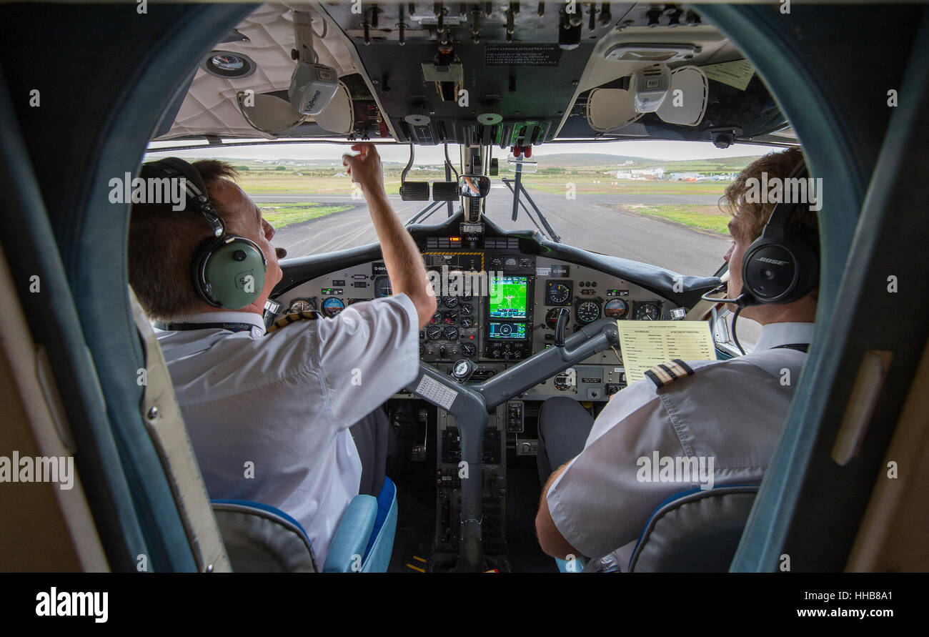 Aircraft Cockpit with pilots Stock Photo - Alamy