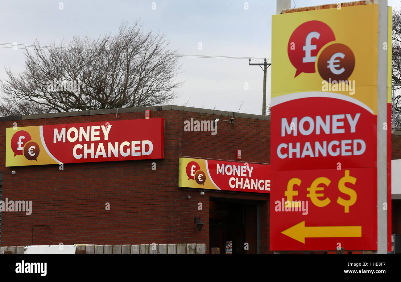Currency exchange signs on the northern side of the border between ...