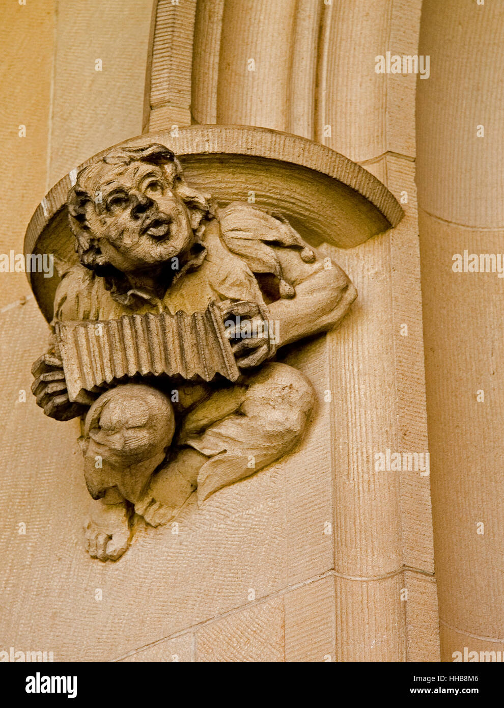 Gargoyle playing an accordion on the base on a column at Biltmore ...