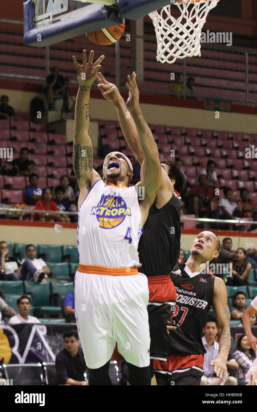 Pasay City, Philippines. 18th Jan, 2017. TNT Katropa's Harvey Carrey gets fouled by Mahindra's ...