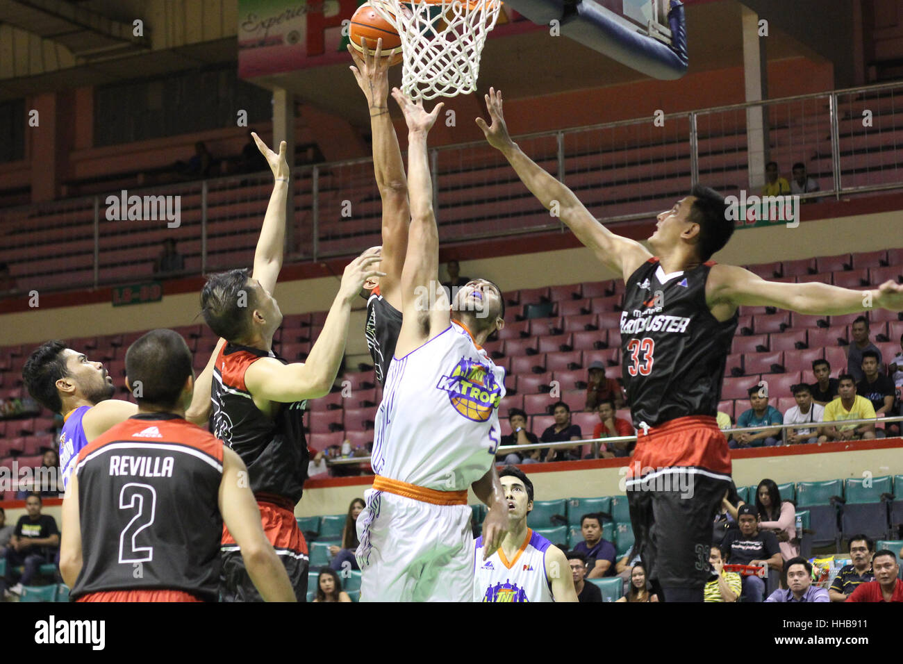 Pasay City, Philippines. 18th Jan, 2017. Frank Golla of TNT Katropa battles with three players ...
