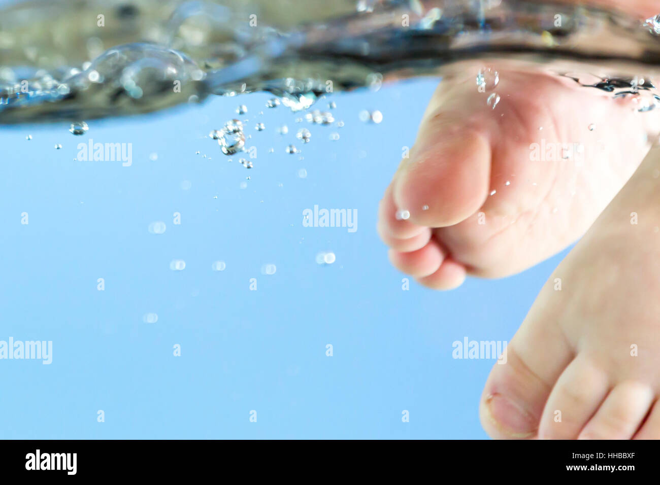 Baby splashing in the pool Stock Photo - Alamy