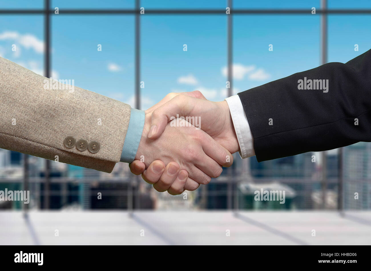 men shaking hands close-up on a white background Stock Photo - Alamy