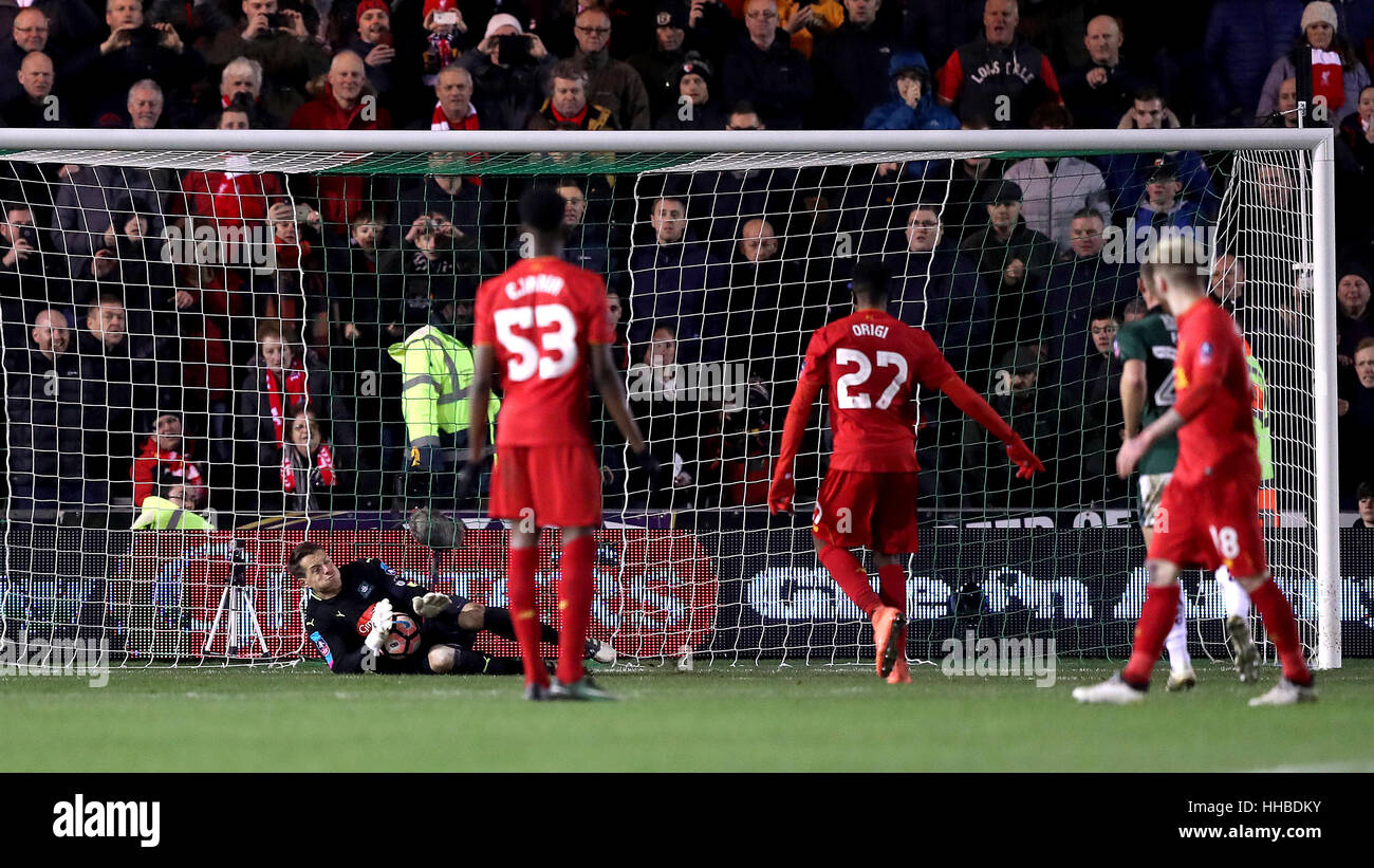 Plymouth Argyle's Luke McCormick (left) saves a penalty from Liverpool ...