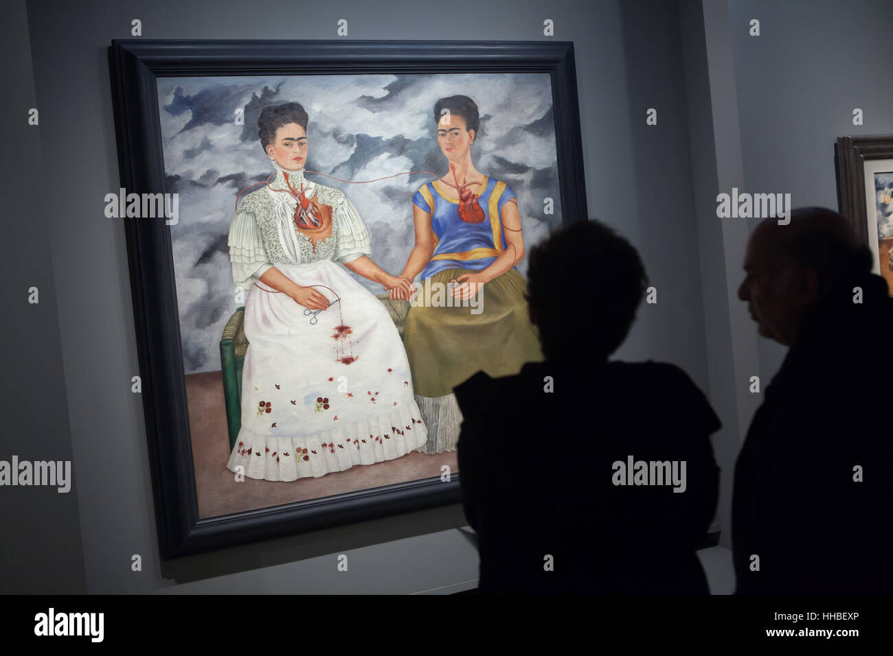 Visitors in front of the painting The Two Fridas (1939) by Mexican ...