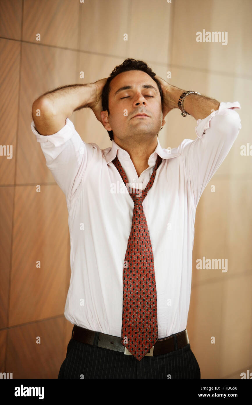 businessman with hands on head Stock Photo - Alamy