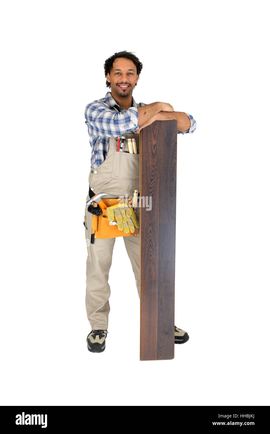 Workman standing with flooring Stock Photo - Alamy