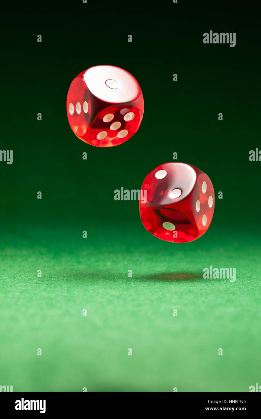 rolling red dice Stock Photo - Alamy