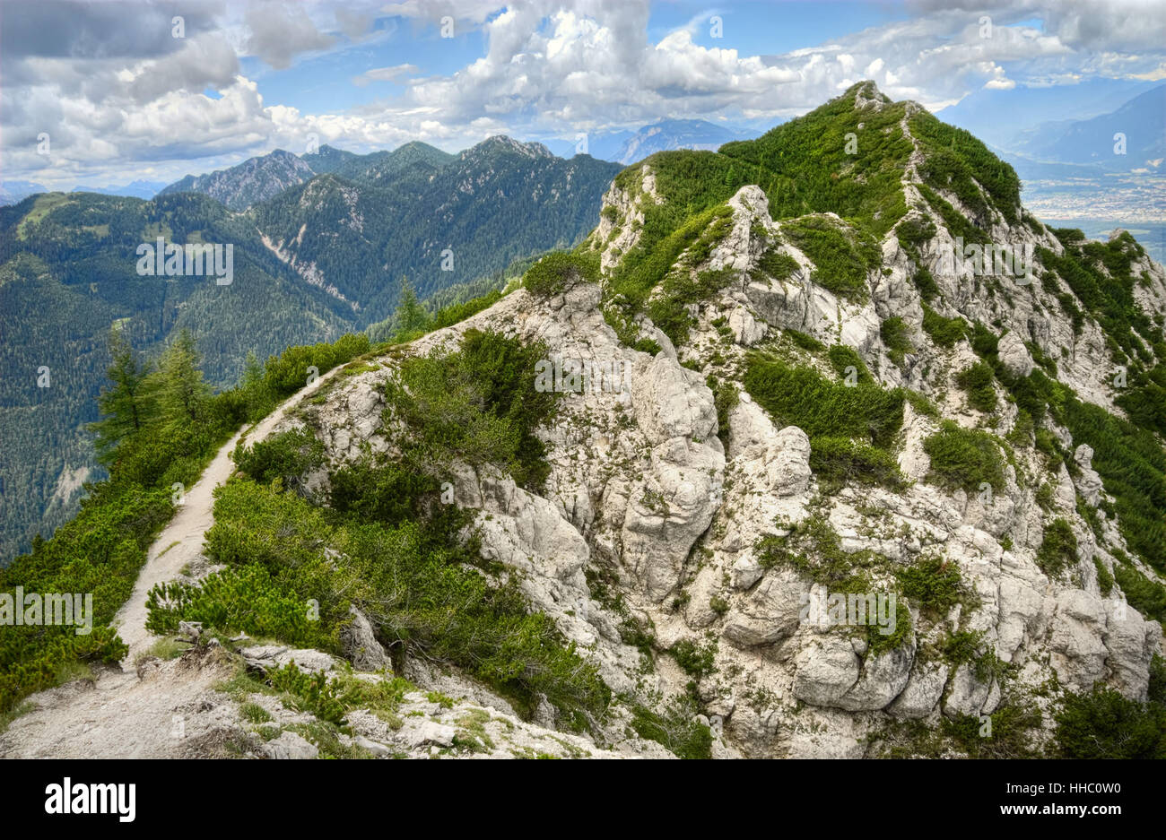 narrow hiking trail leads over a ridge to the summit Stock Photo - Alamy