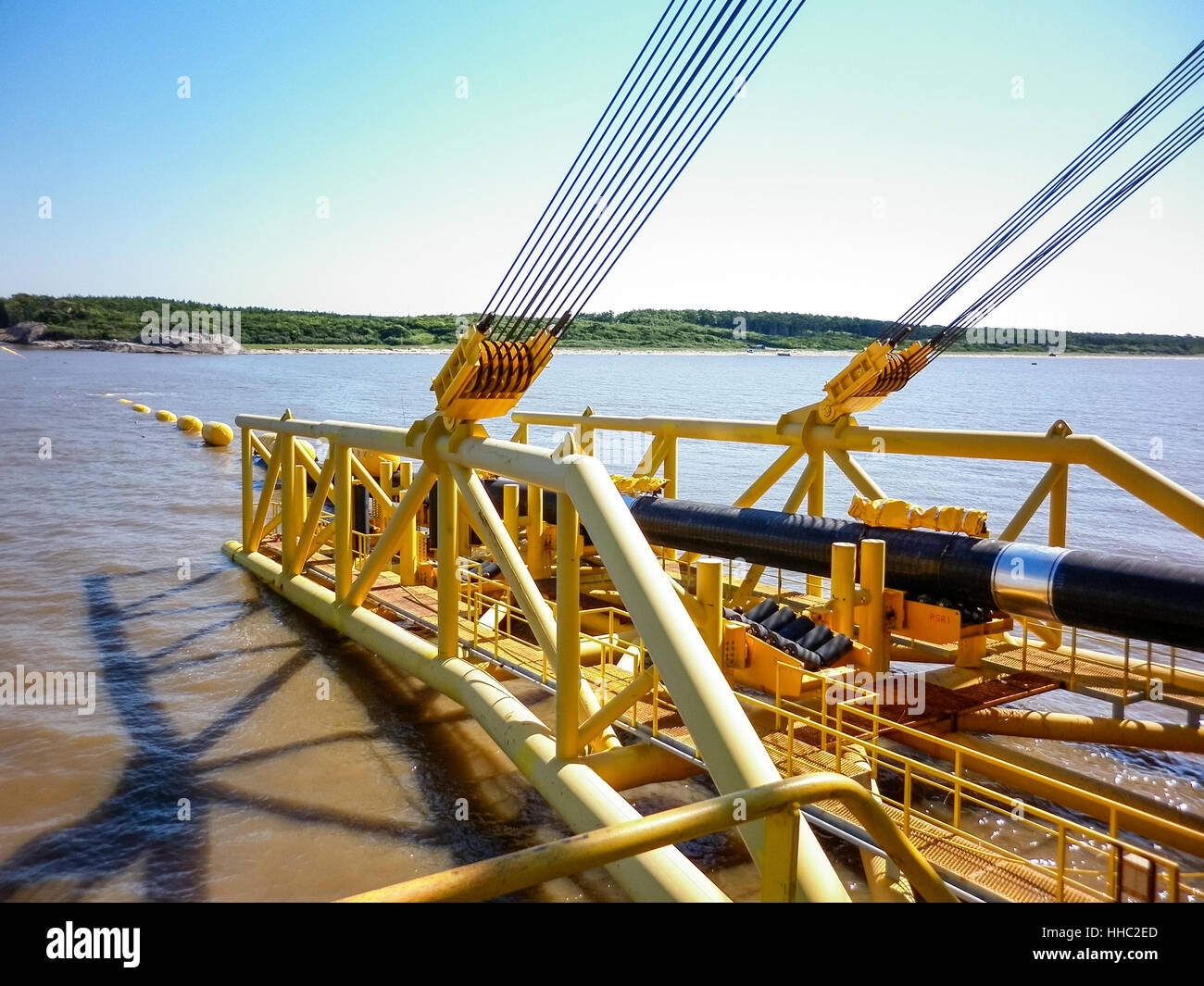 Laying of pipes with pipe-laying barge crane near the shore Stock Photo ...