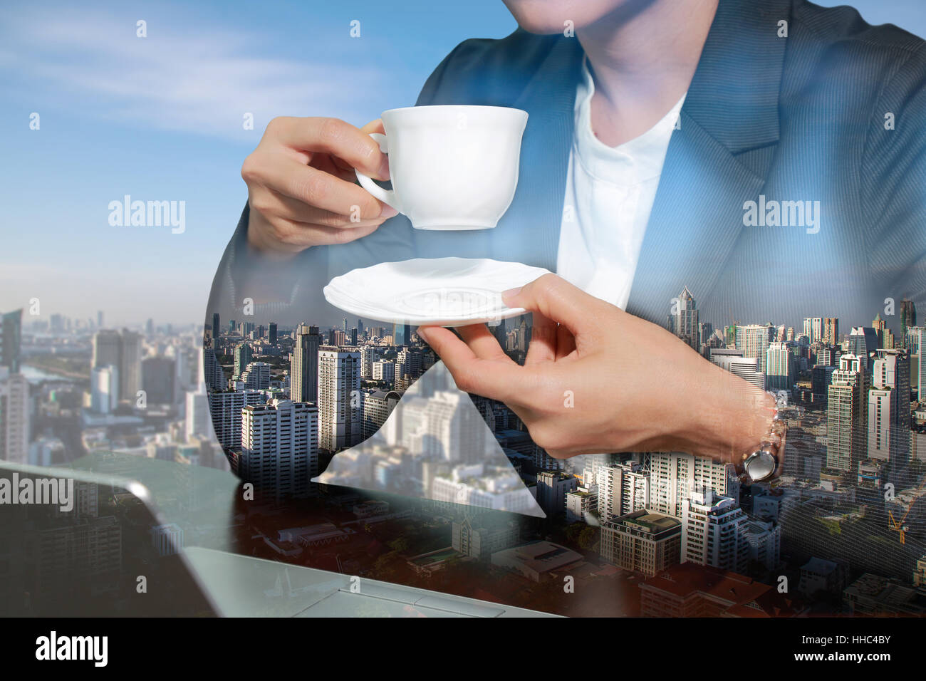 Double exposure of business woman drink a coffee, tea and cityscape on ...