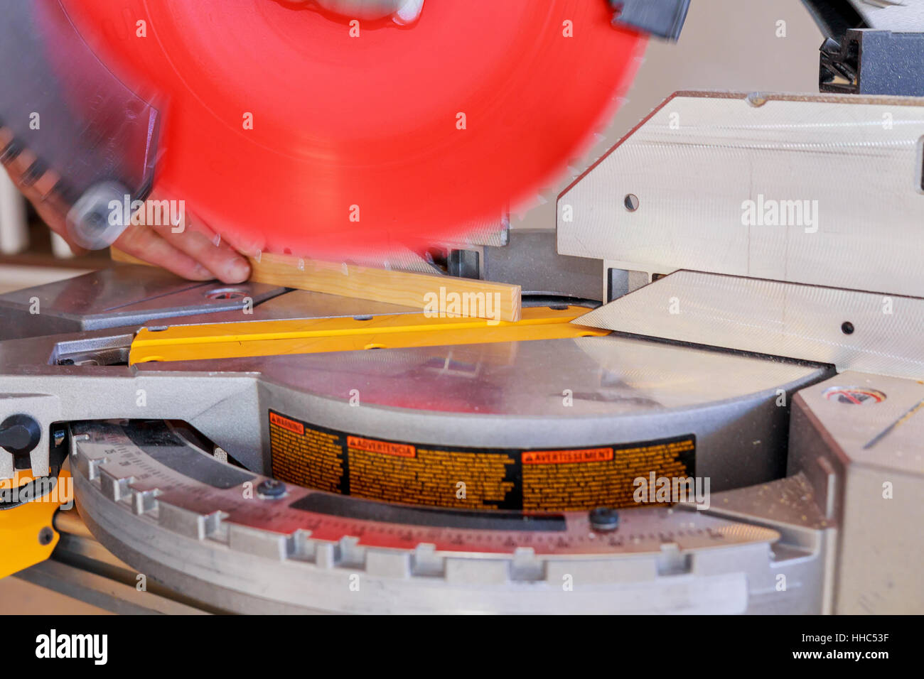 Man using saw to cut wood Man, worker sawing wood Stock Photo - Alamy