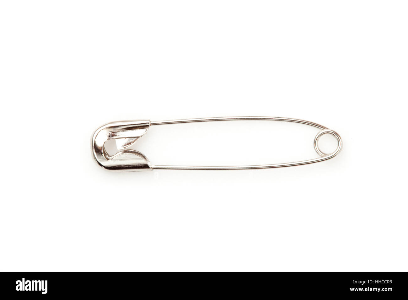 Close up of a safety pin against a white background Stock Photo - Alamy