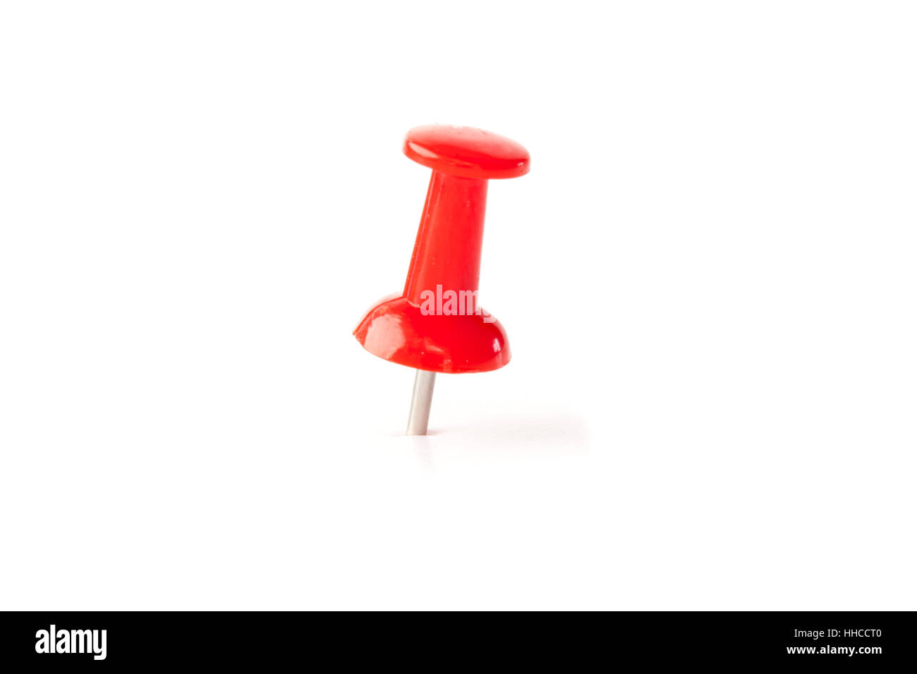 Close up of a red push pin against a white background Stock Photo - Alamy