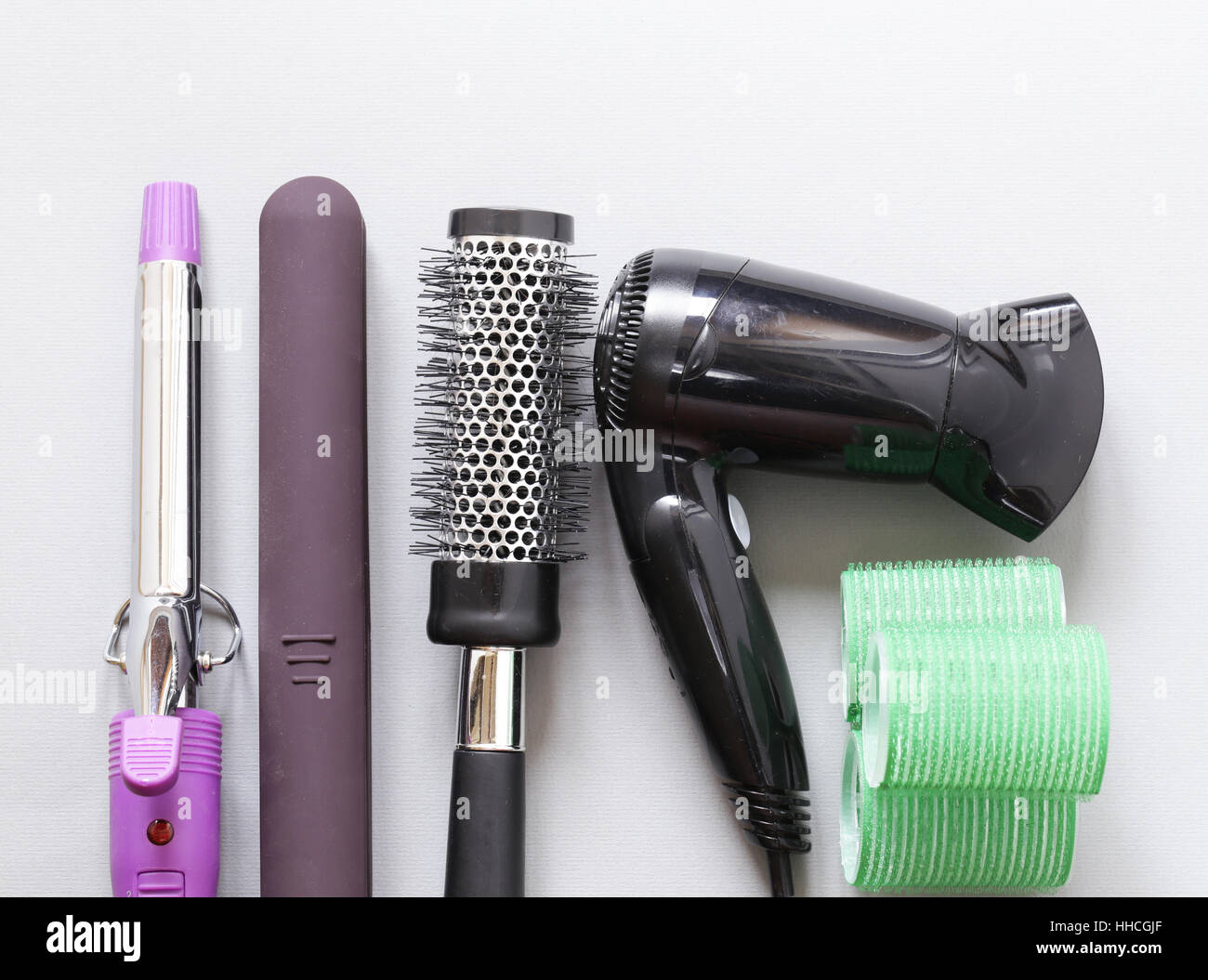 Set the tools hairdressers - hair dryer, curling iron, comb Stock Photo ...