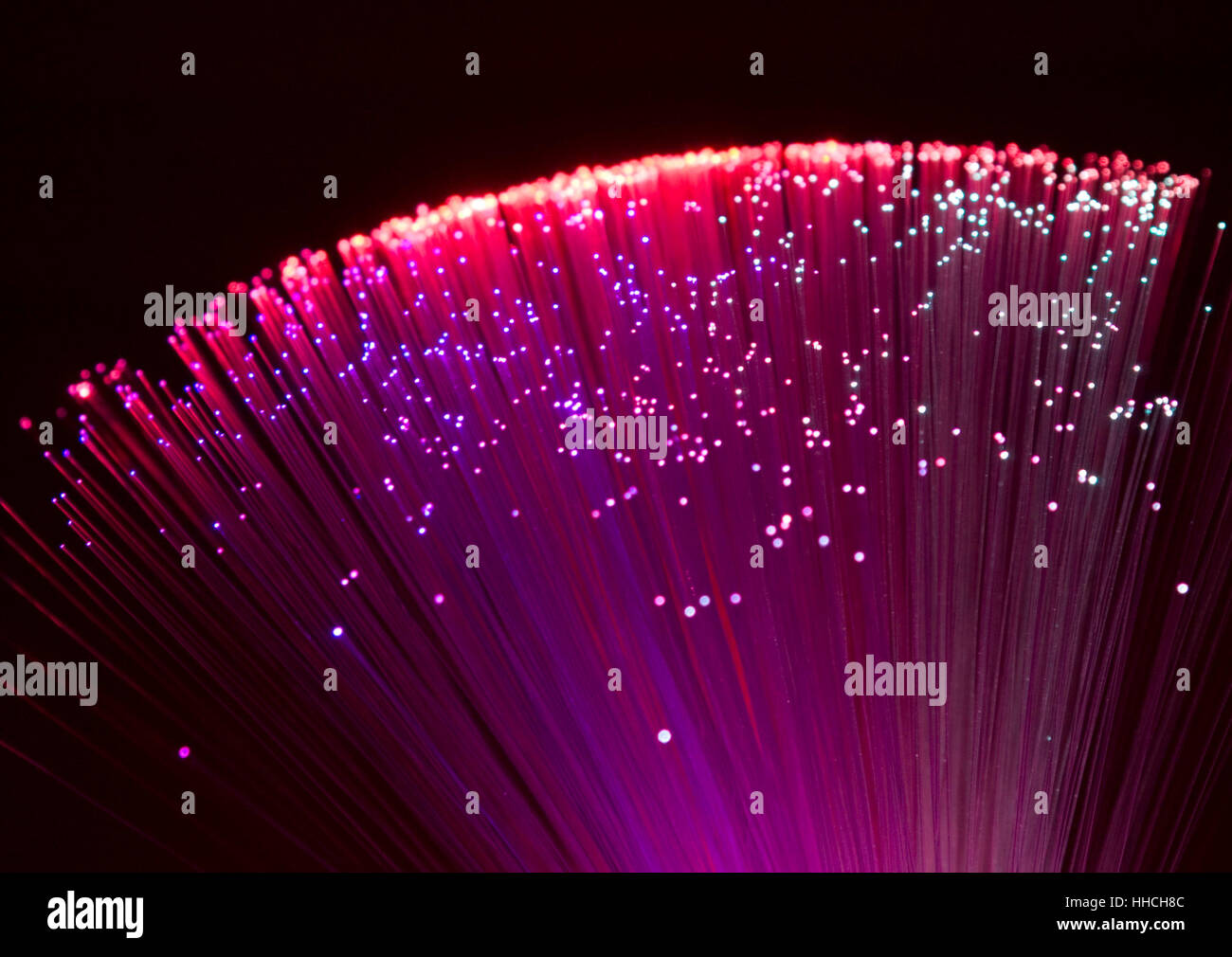 colorful illuminated plastic optical fibers in dark back Stock Photo ...