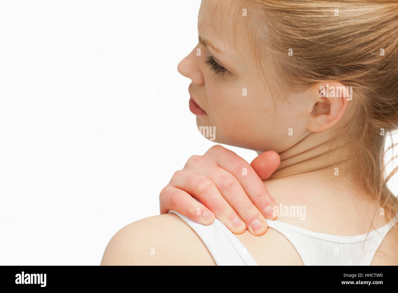 Close up of a woman massaging her nap against white background Stock ...
