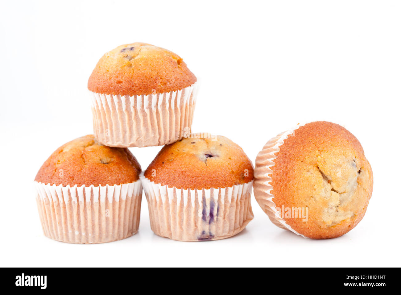 Muffins piled up against a white background Stock Photo - Alamy
