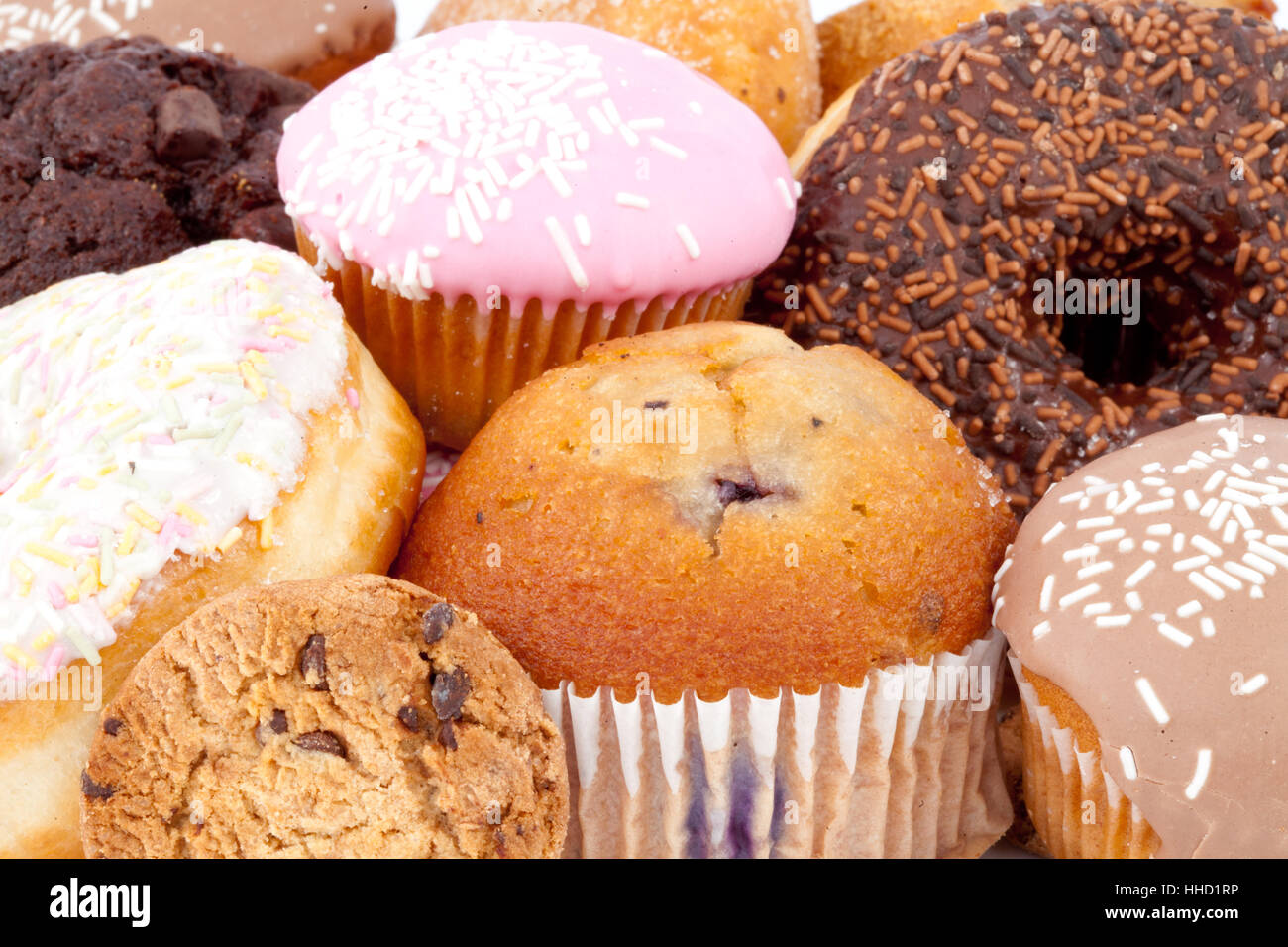 Cakes with icing sugar against a white background Stock Photo - Alamy