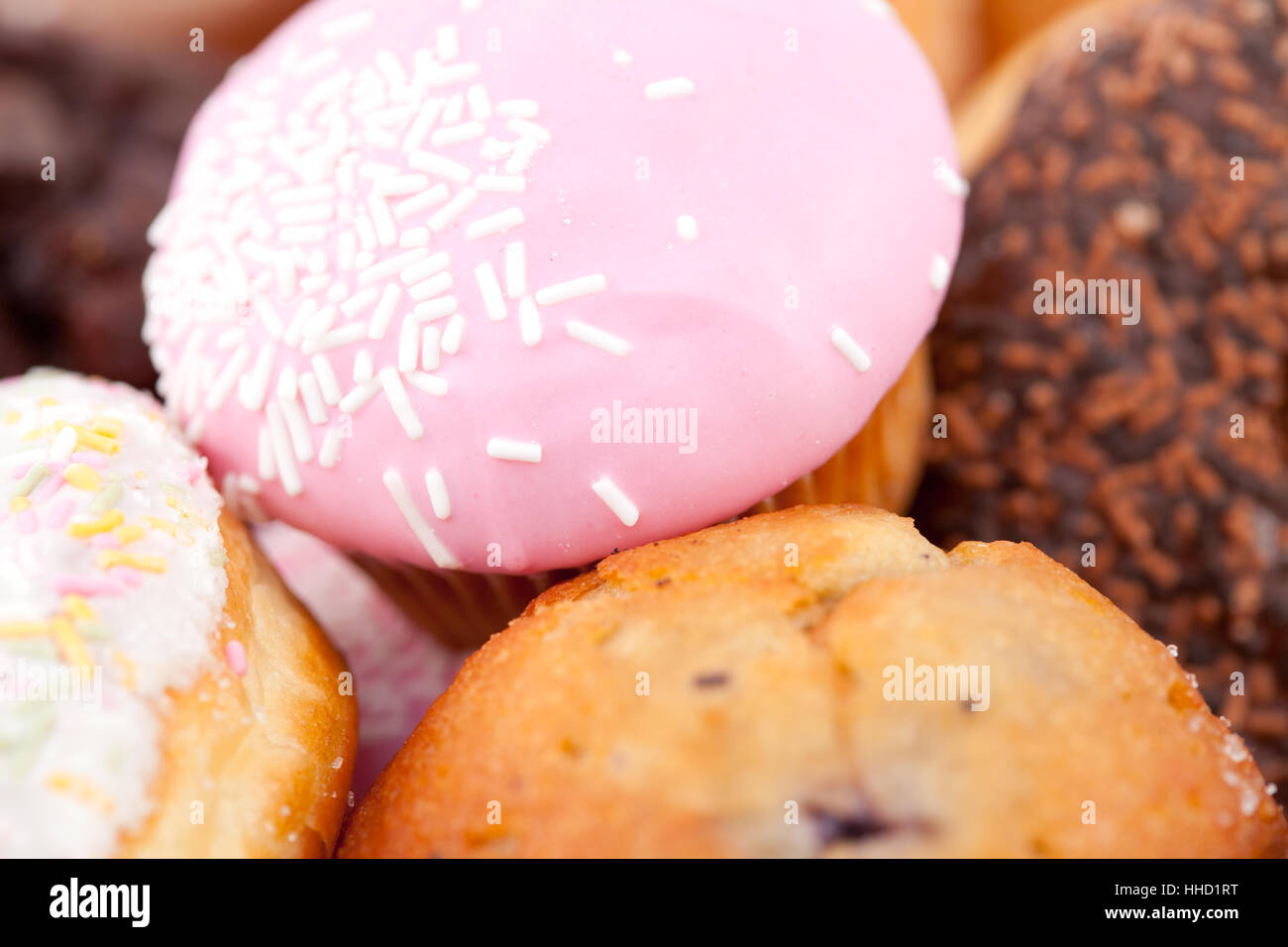 Close up on cakes with icing sugar against a white background Stock ...