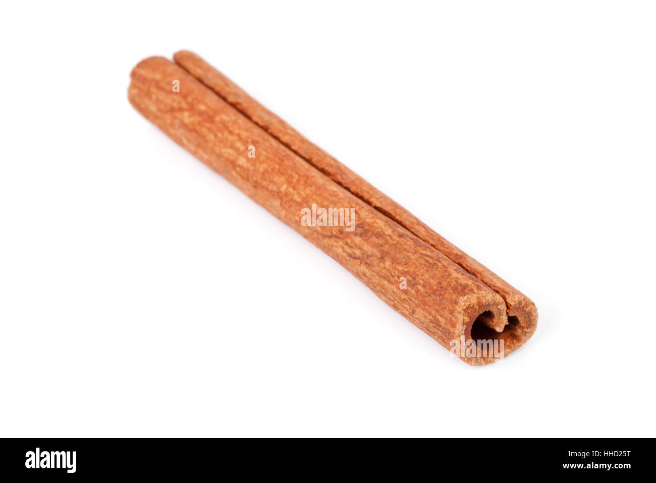 Single cinnamon stick against a white background Stock Photo - Alamy