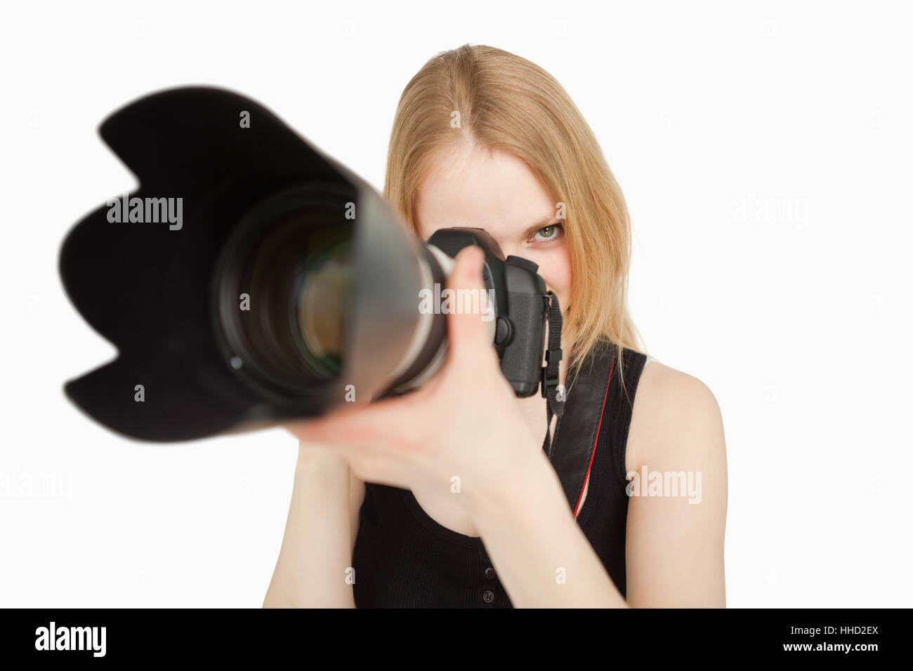 Woman using her camera against white background Stock Photo - Alamy