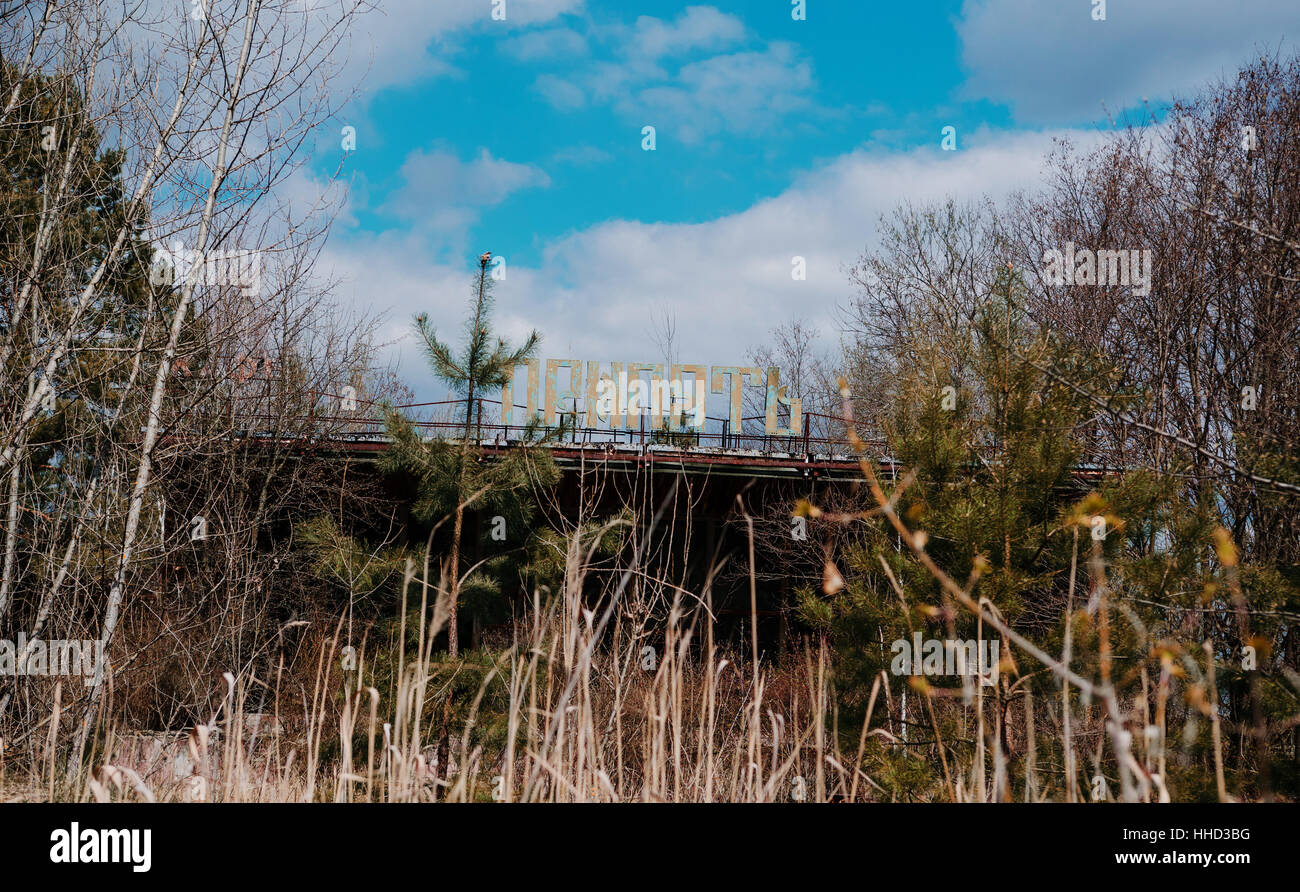 Llarge inscription in Russian "Pripyat" sign at the entrance to city in ...