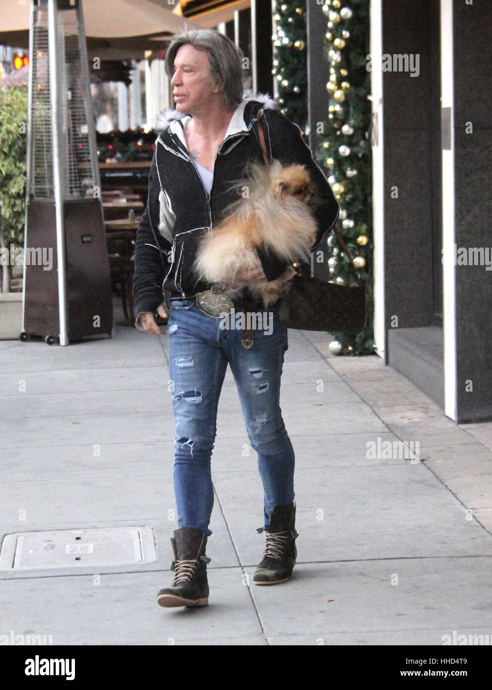 Mickey Rourke leaves Caffe Roma carrying his pet dog Featuring: Mickey ...