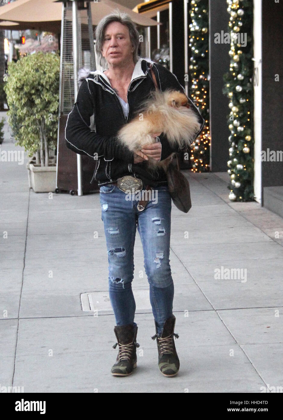 Mickey Rourke leaves Caffe Roma carrying his pet dog Featuring: Mickey ...