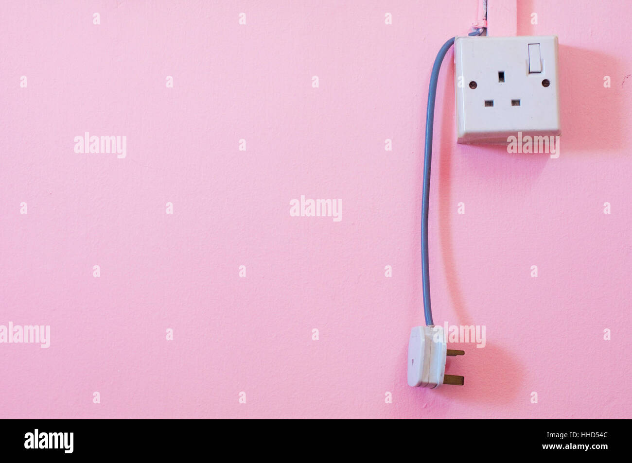 asian type electrical power outlet with pink wall Stock Photo - Alamy