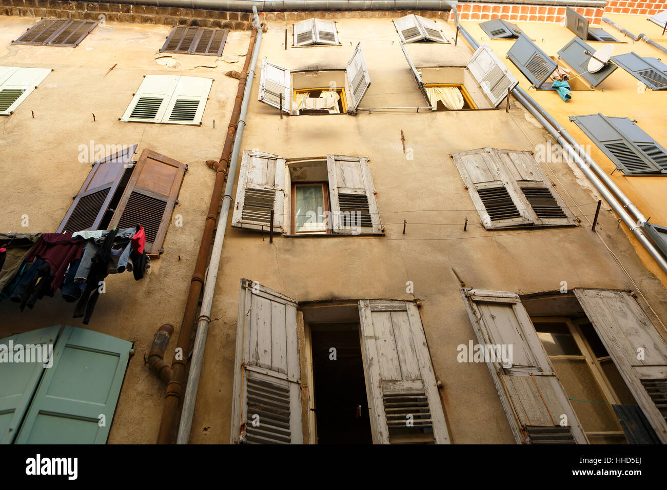 Typical facade with windows and shutters, typical alley, Grasse; Alpes ...