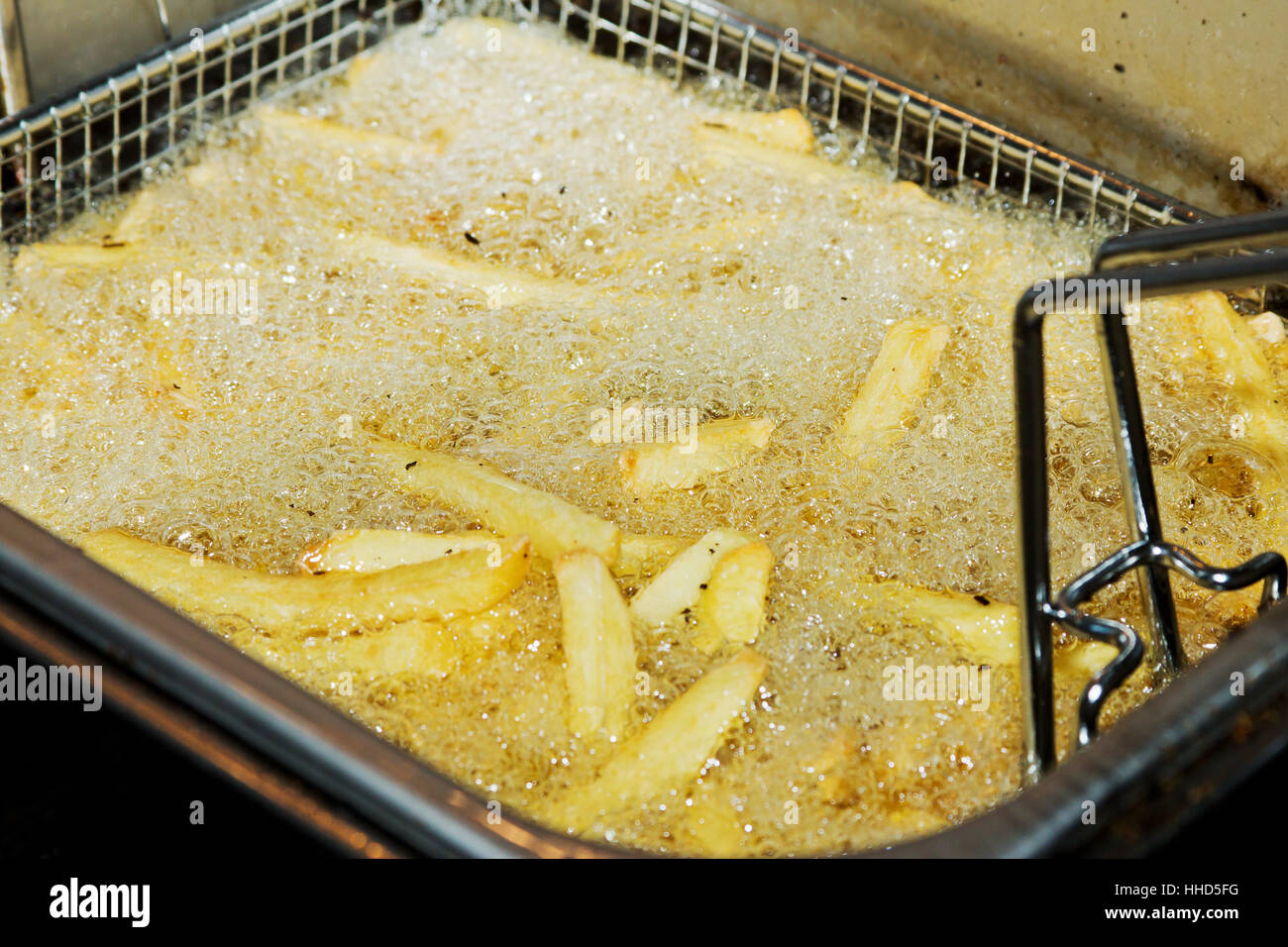 french fries in the fryer Stock Photo - Alamy