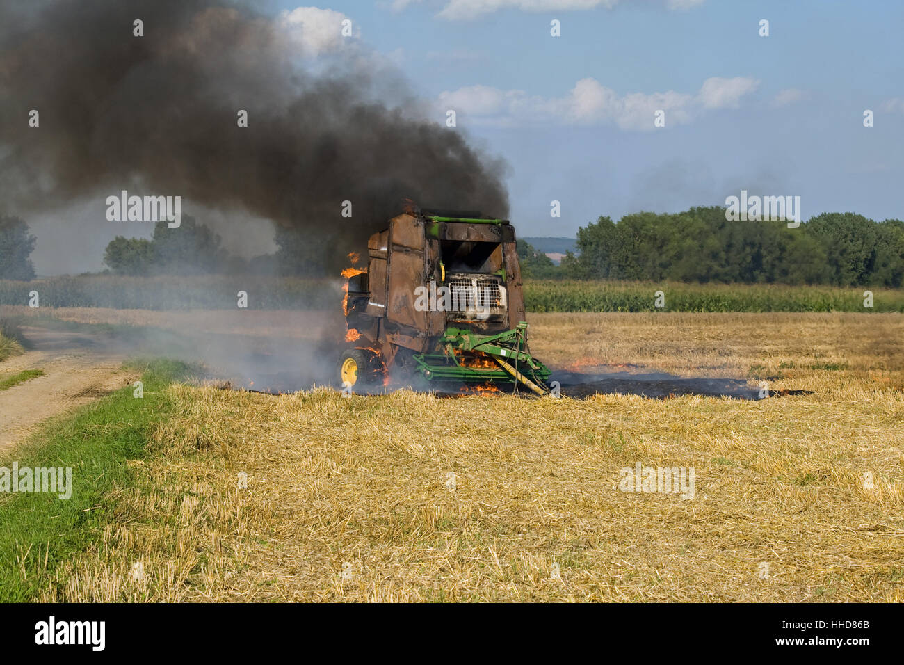 burning round baler Stock Photo - Alamy