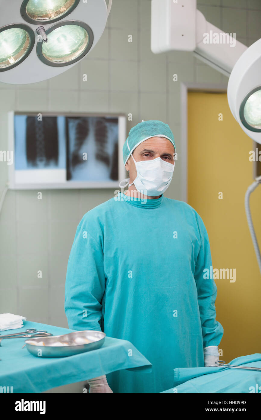 Serious surgeon standing in operating theater Stock Photo - Alamy