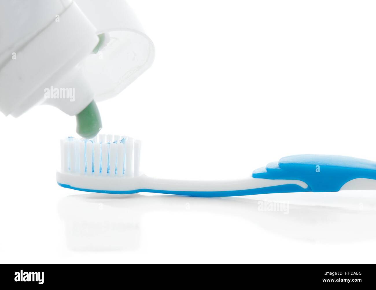 Putting toothpaste on the toothbrush Stock Photo - Alamy