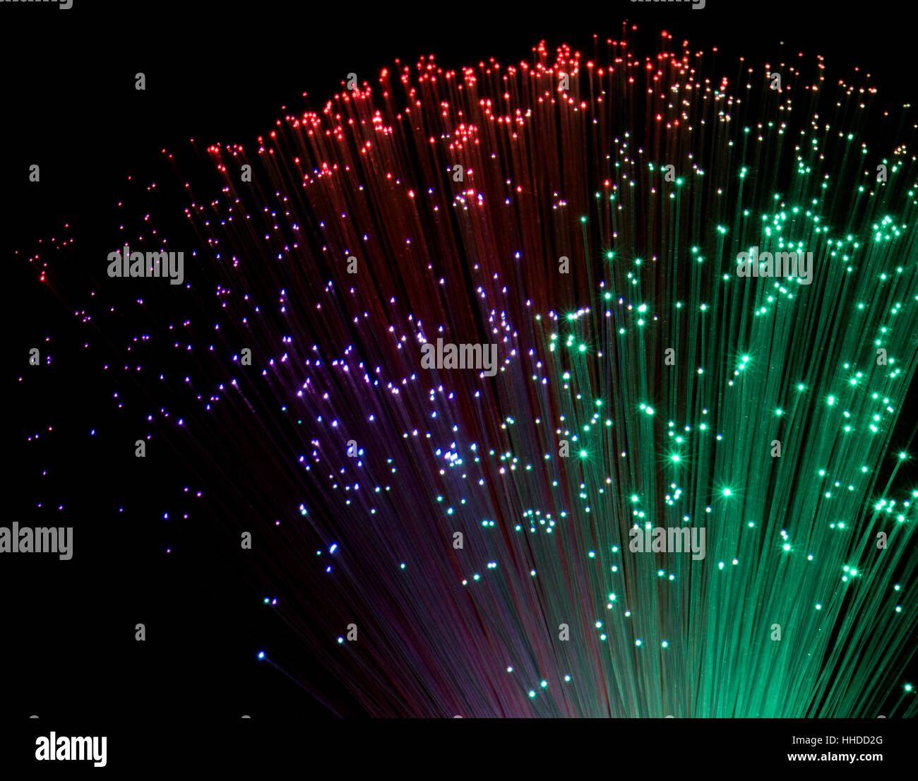 colorful illuminated plastic optical fibers in dark back Stock Photo ...