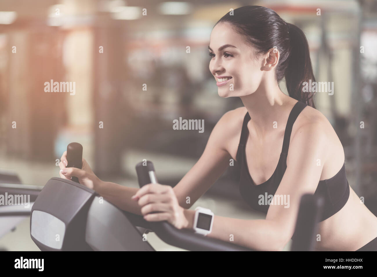 Pretty girl running on a treadmill Stock Photo - Alamy