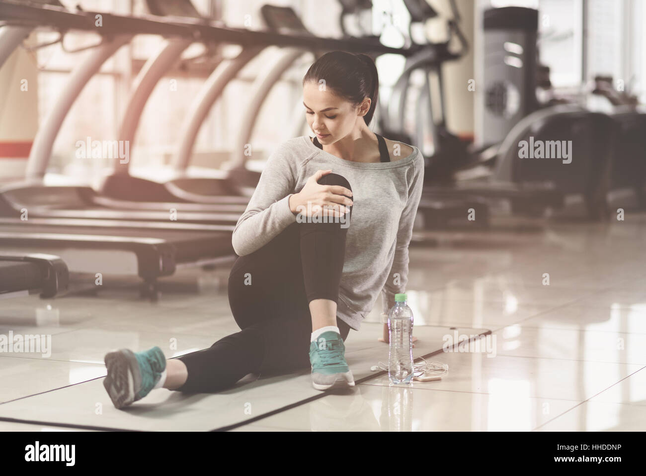 Tired woman relaxing after workout Stock Photo - Alamy
