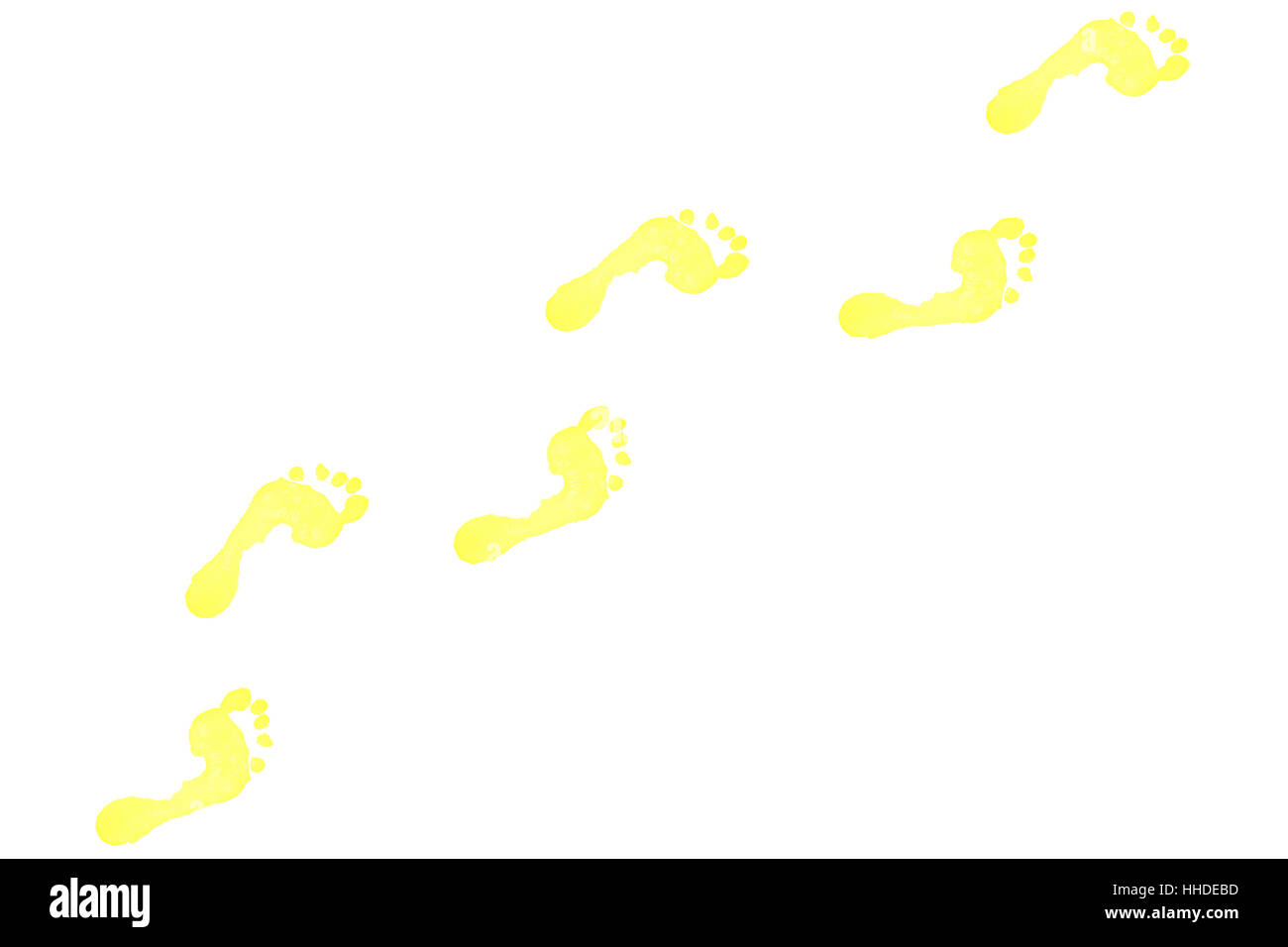 Six yellow footprints against a white background Stock Photo - Alamy