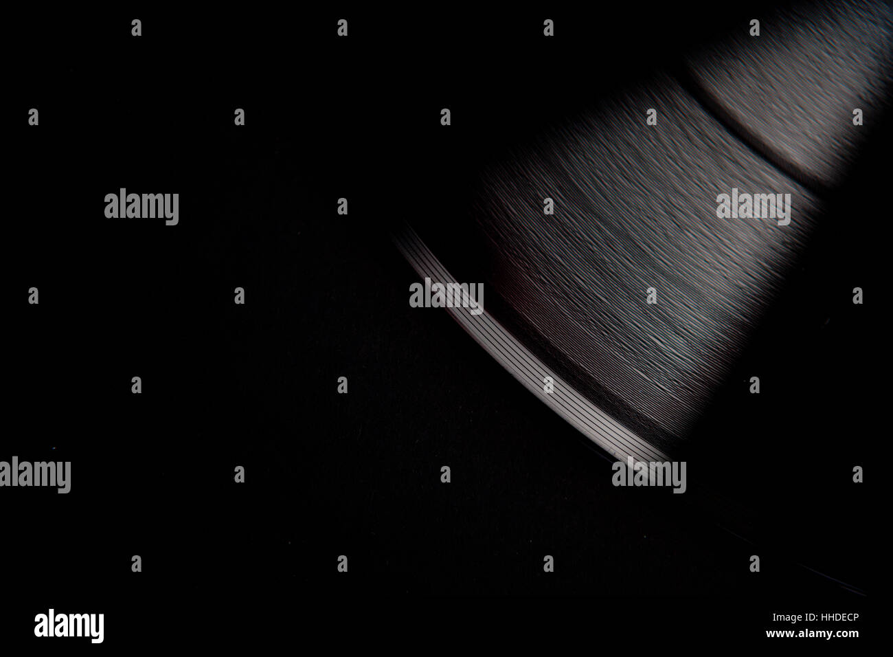 Black compact disc against a black background Stock Photo - Alamy