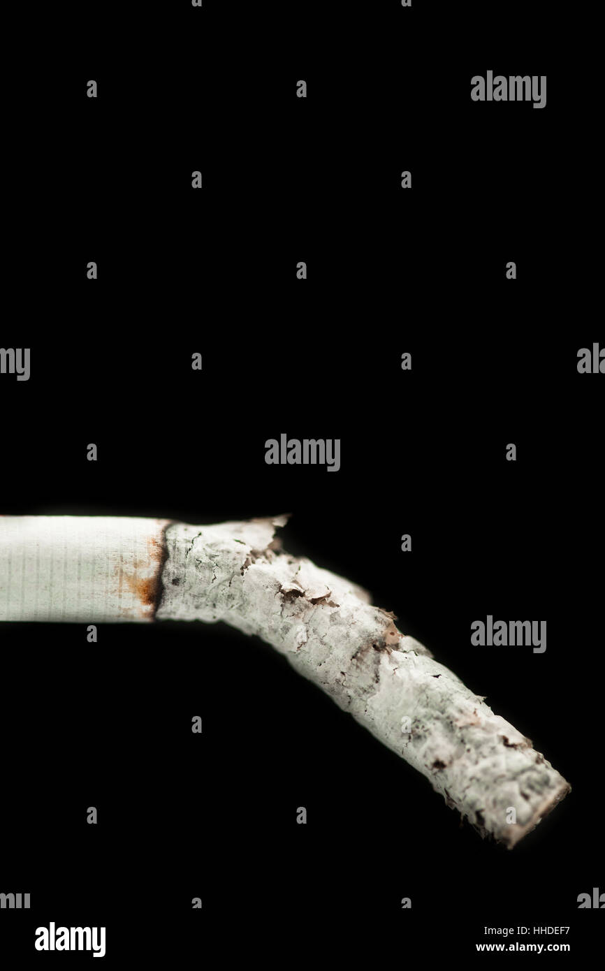 Cinder of cigarette against a black backgrouns Stock Photo - Alamy