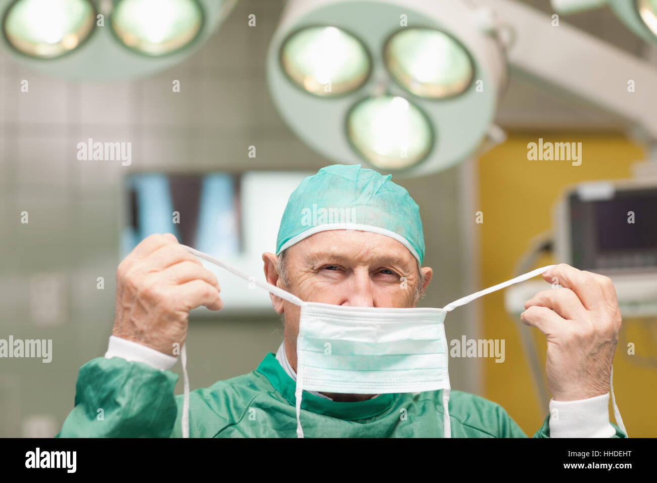 Surgeon getting dressed in a surgical room Stock Photo - Alamy