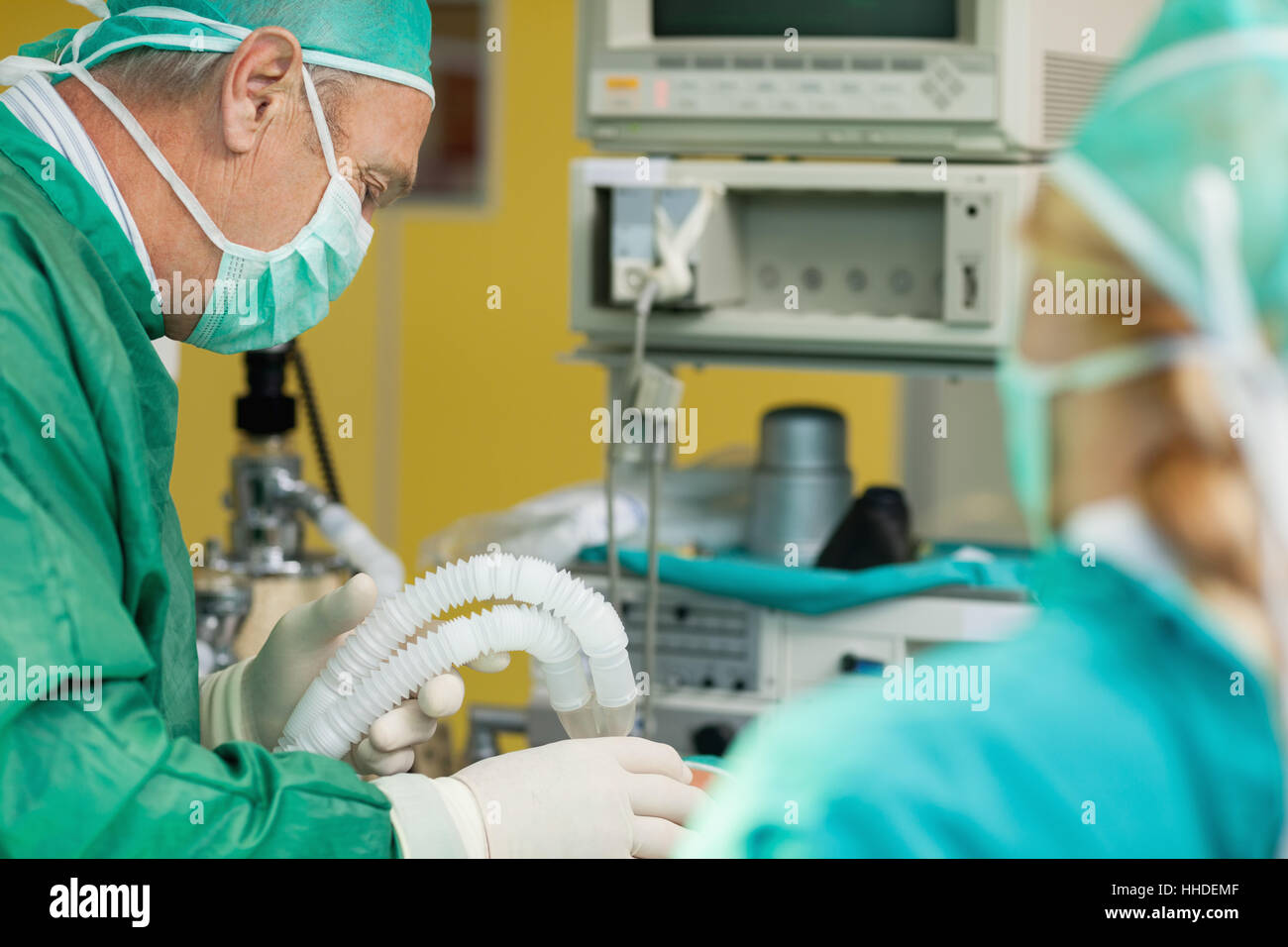 Surgeon working on a patient in a surgical room Stock Photo - Alamy