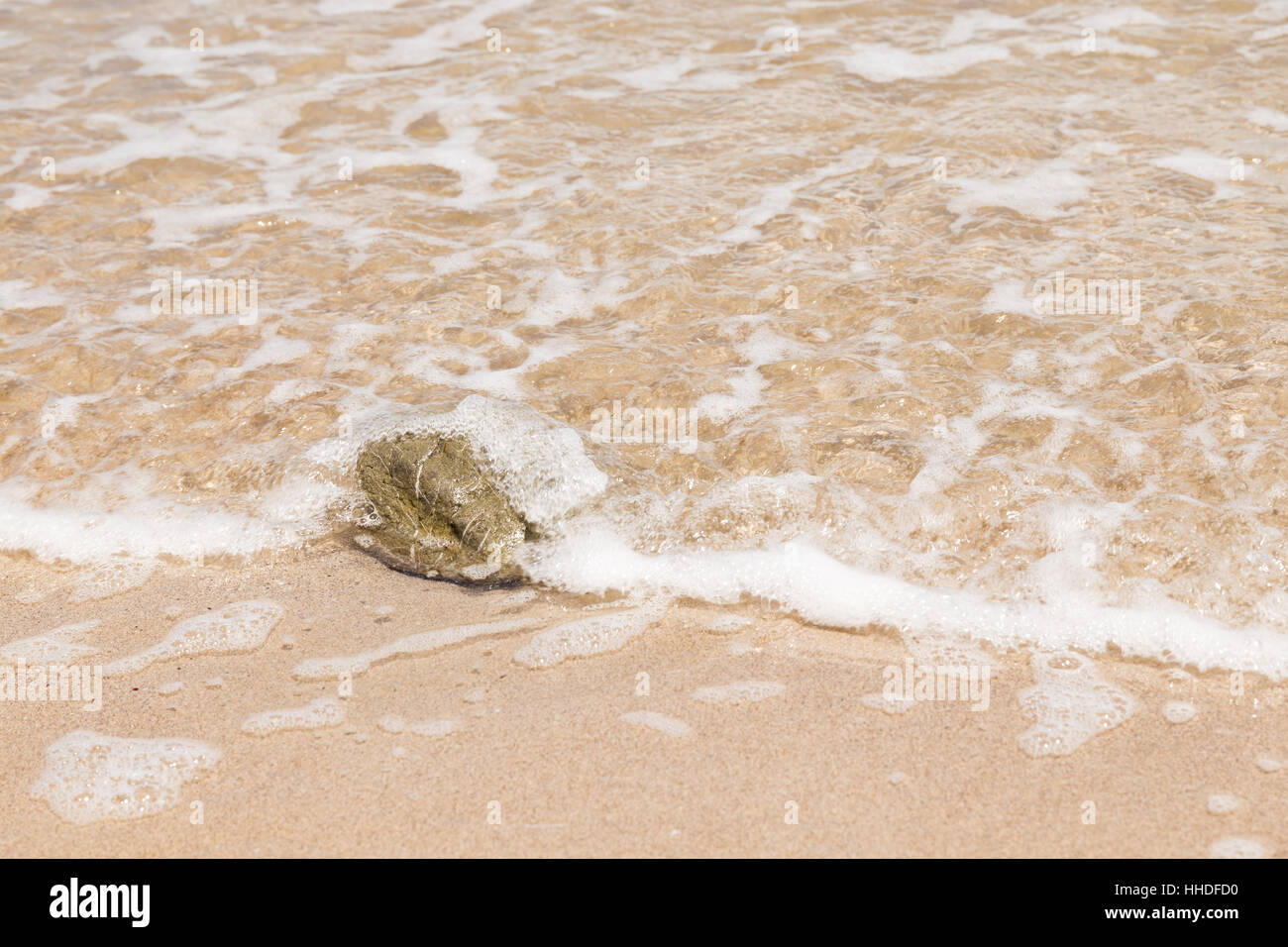 Small stone on sand beach Stock Photo - Alamy
