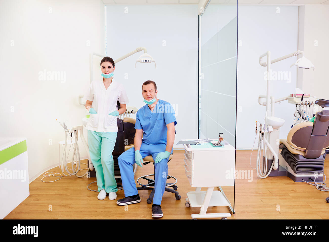 Dentist male and assistant women the workplace a dental office Stock ...