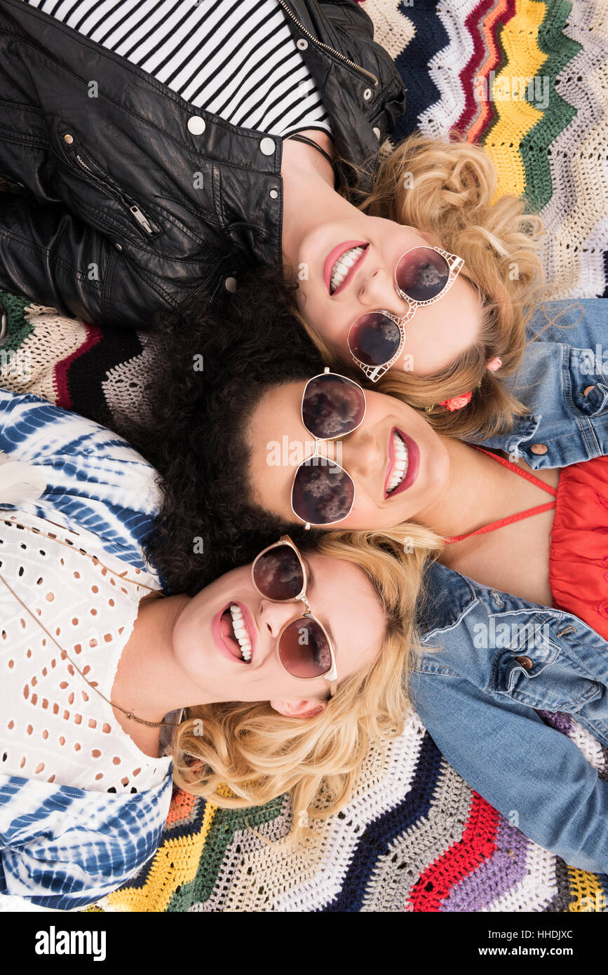 Three friends at the festival Stock Photo - Alamy