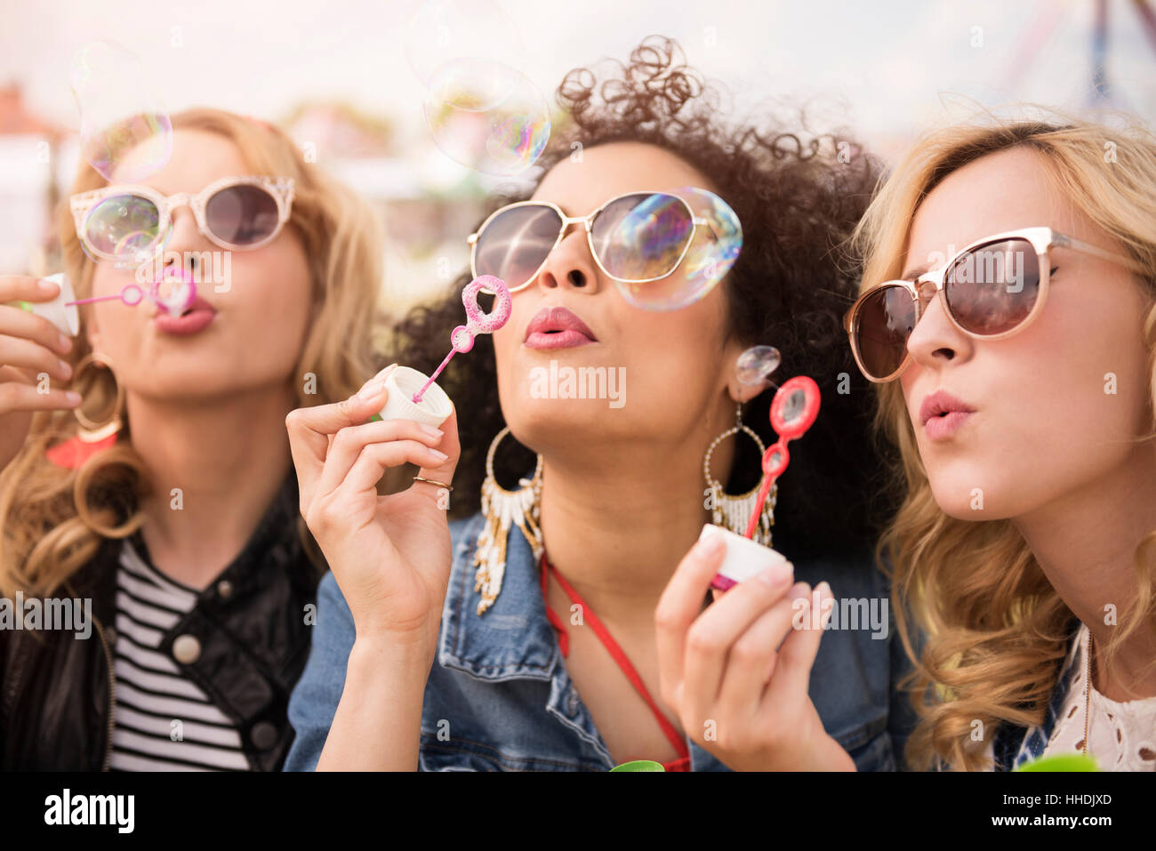 Best friends making soap bubbles Stock Photo - Alamy