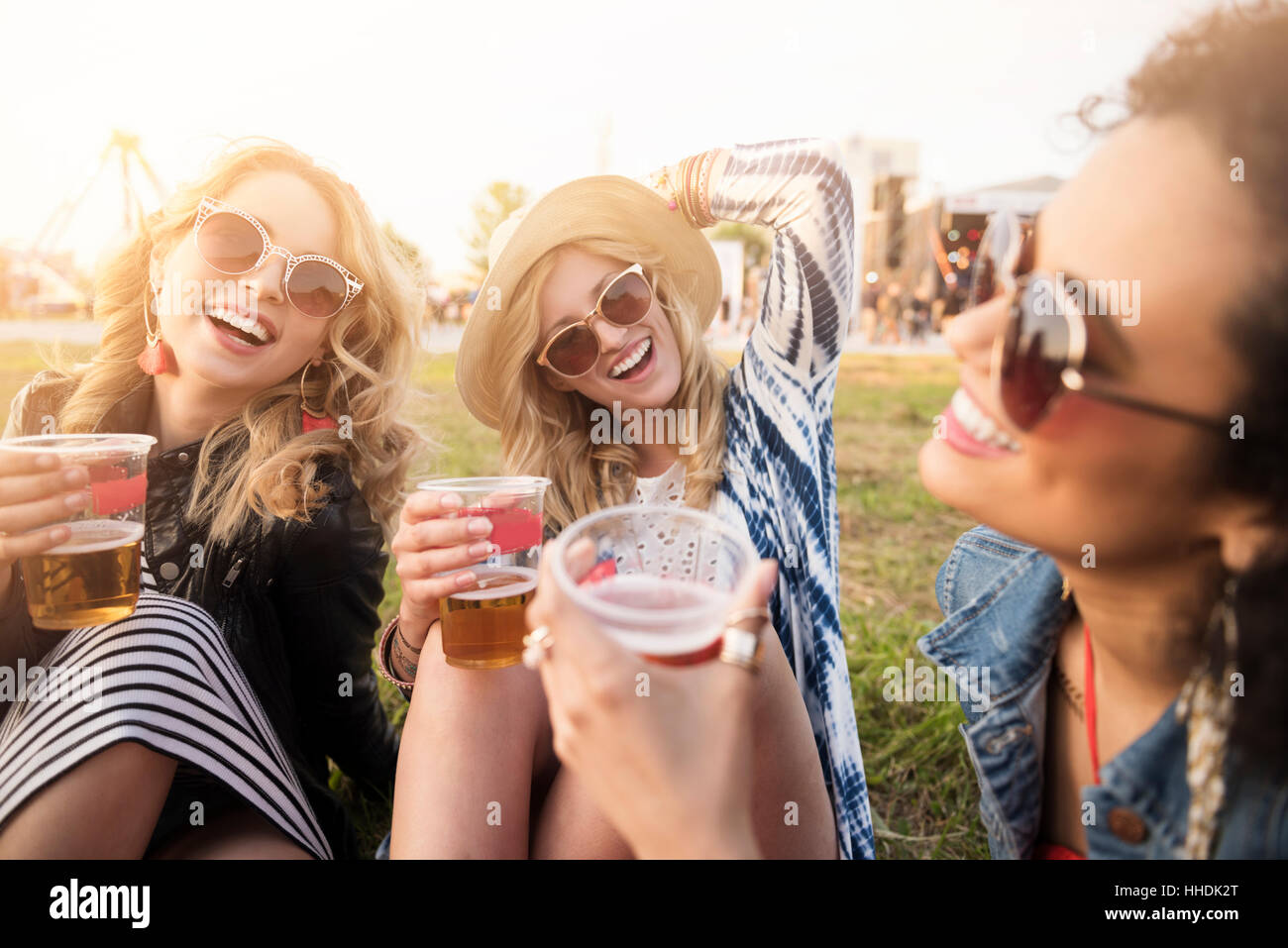 Girls drinking beer in front of the stage Stock Photo - Alamy