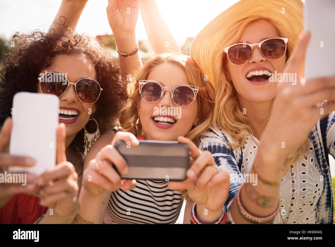 Taking photo of favorite singer Stock Photo - Alamy